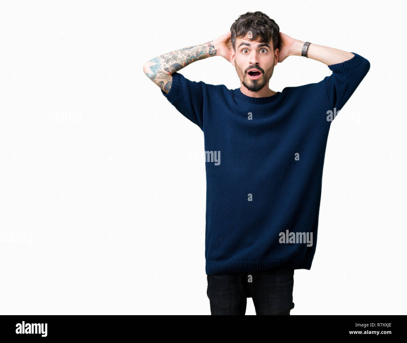 Young handsome man over isolated background Crazy and scared with hands ...