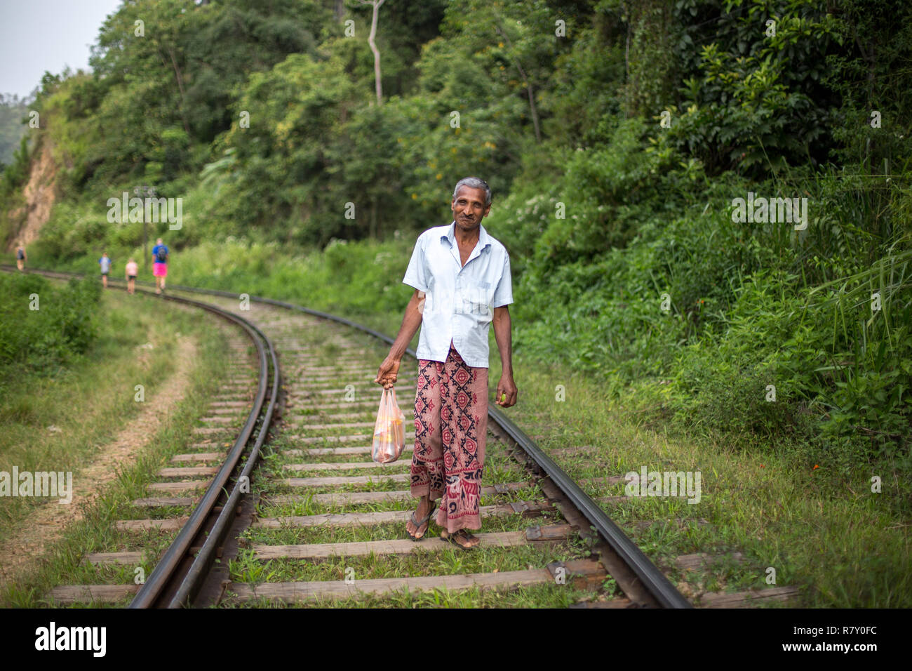 Man walking on rail track hi-res stock photography and images - Alamy