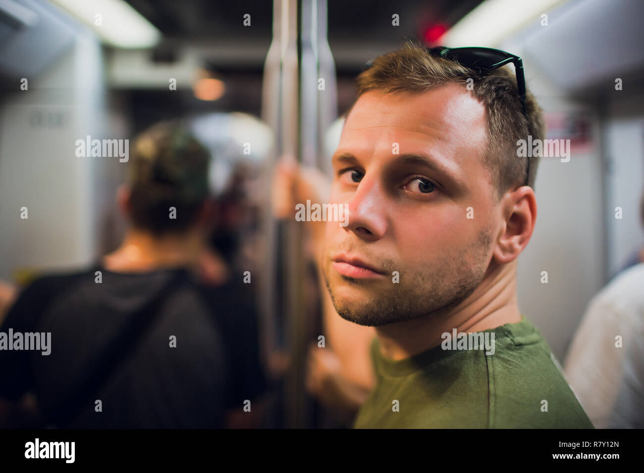 Guy in an empty subway car, he's sad with loneliness Stock Photo - Alamy