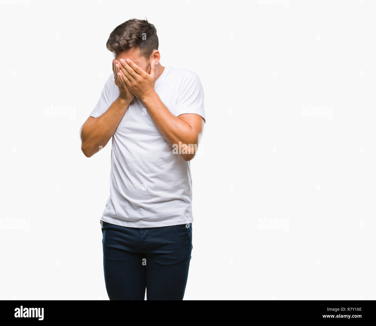Young handsome man over isolated background with sad expression ...