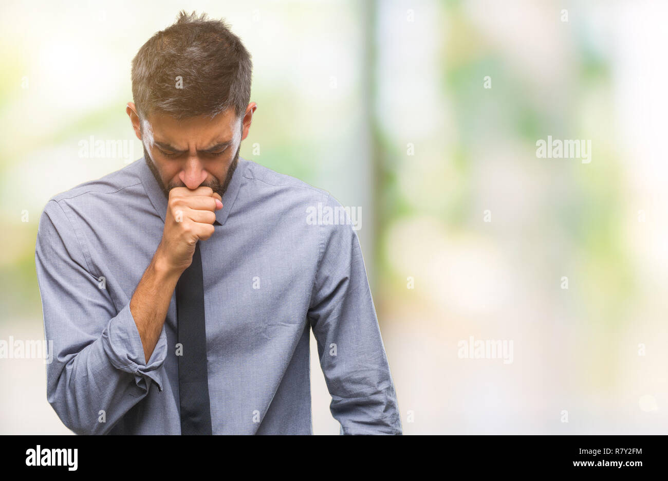 Adult hispanic business man over isolated background feeling unwell and ...