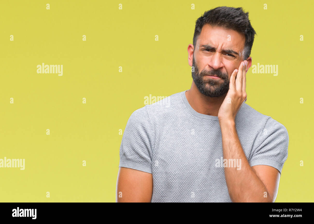 Adult hispanic man over isolated background thinking looking tired and ...