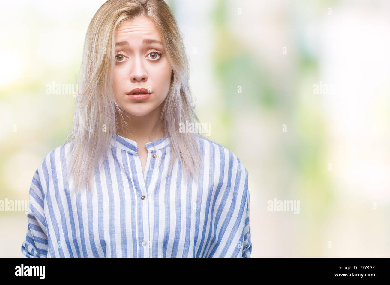 Young blonde woman over isolated background depressed and worry for ...