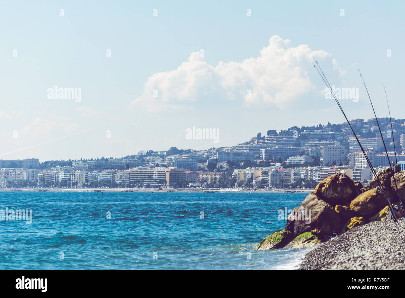 Fishing rods at a beach in spring Stock Photo - Alamy