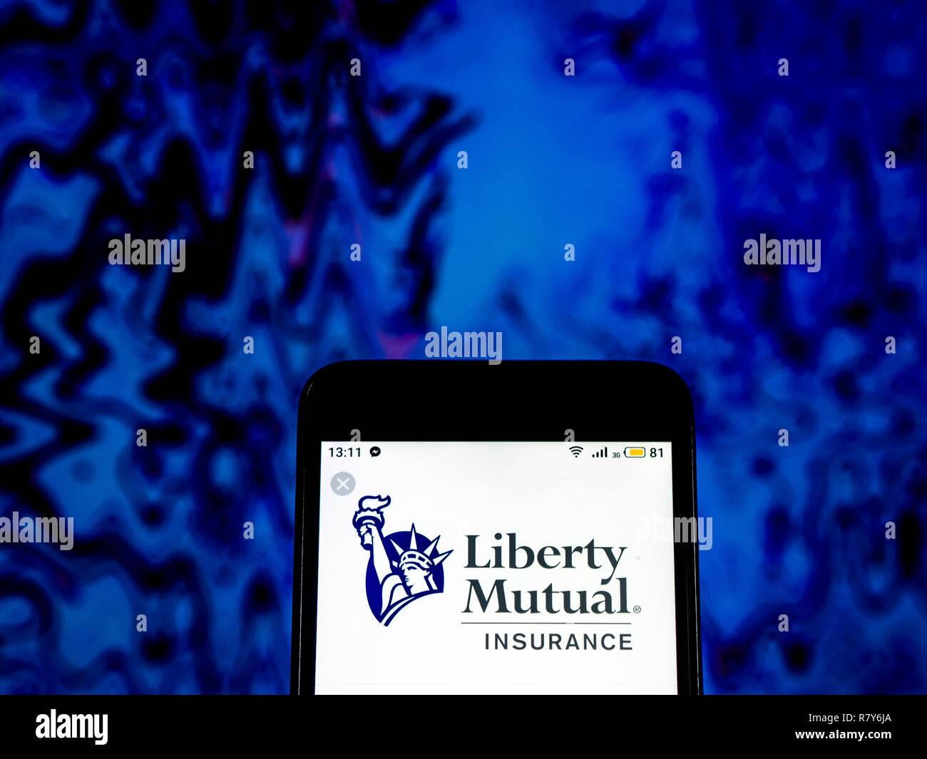 Liberty Mutual Insurance company logo seen displayed on smart phone ...
