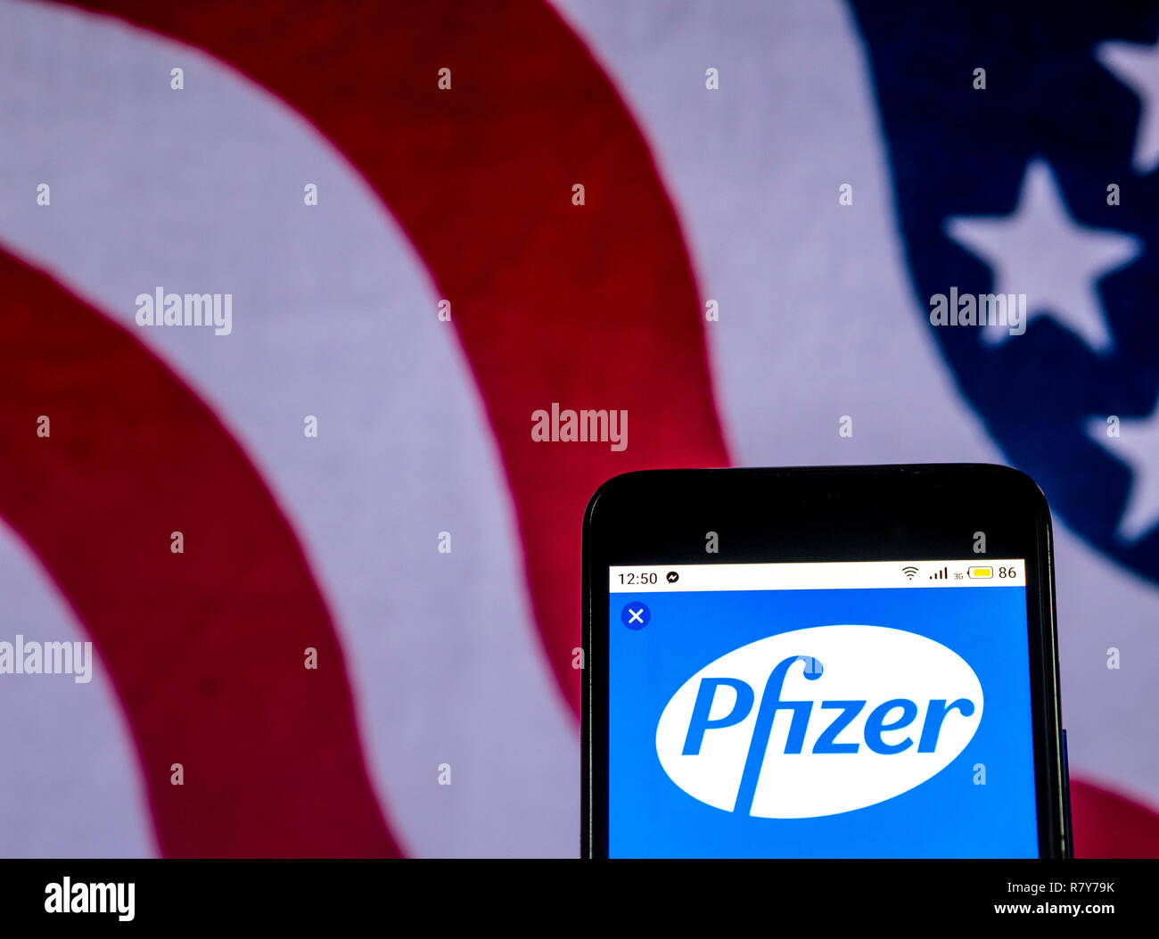Pfizer Pharmaceutical company logo seen displayed on smart phone Stock ...