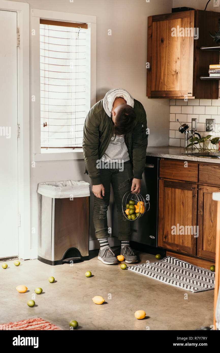 Upset and Defeated Young Adult Person Accidentally Spills Basket of ...