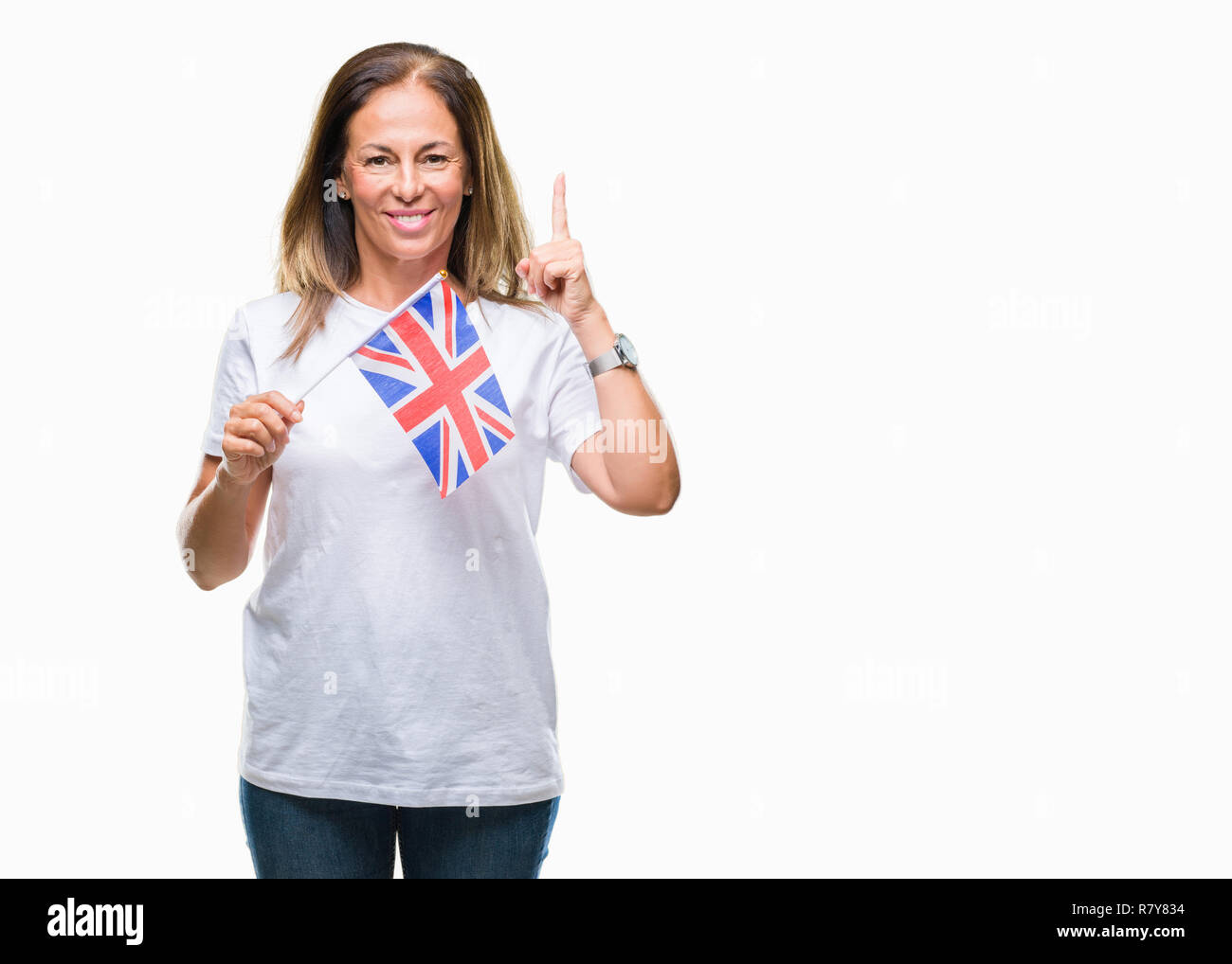 Middle age hispanic woman holding flag of United Kingdom over isolated ...