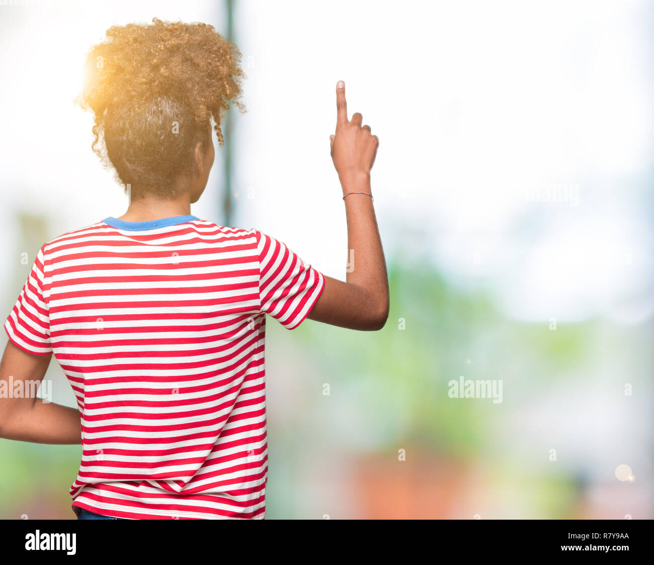 Beautiful young african american woman over isolated background Posing ...