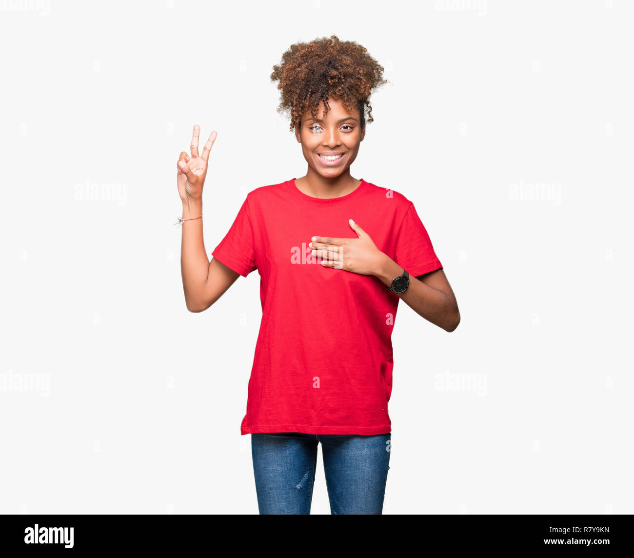 Beautiful young african american woman over isolated background ...