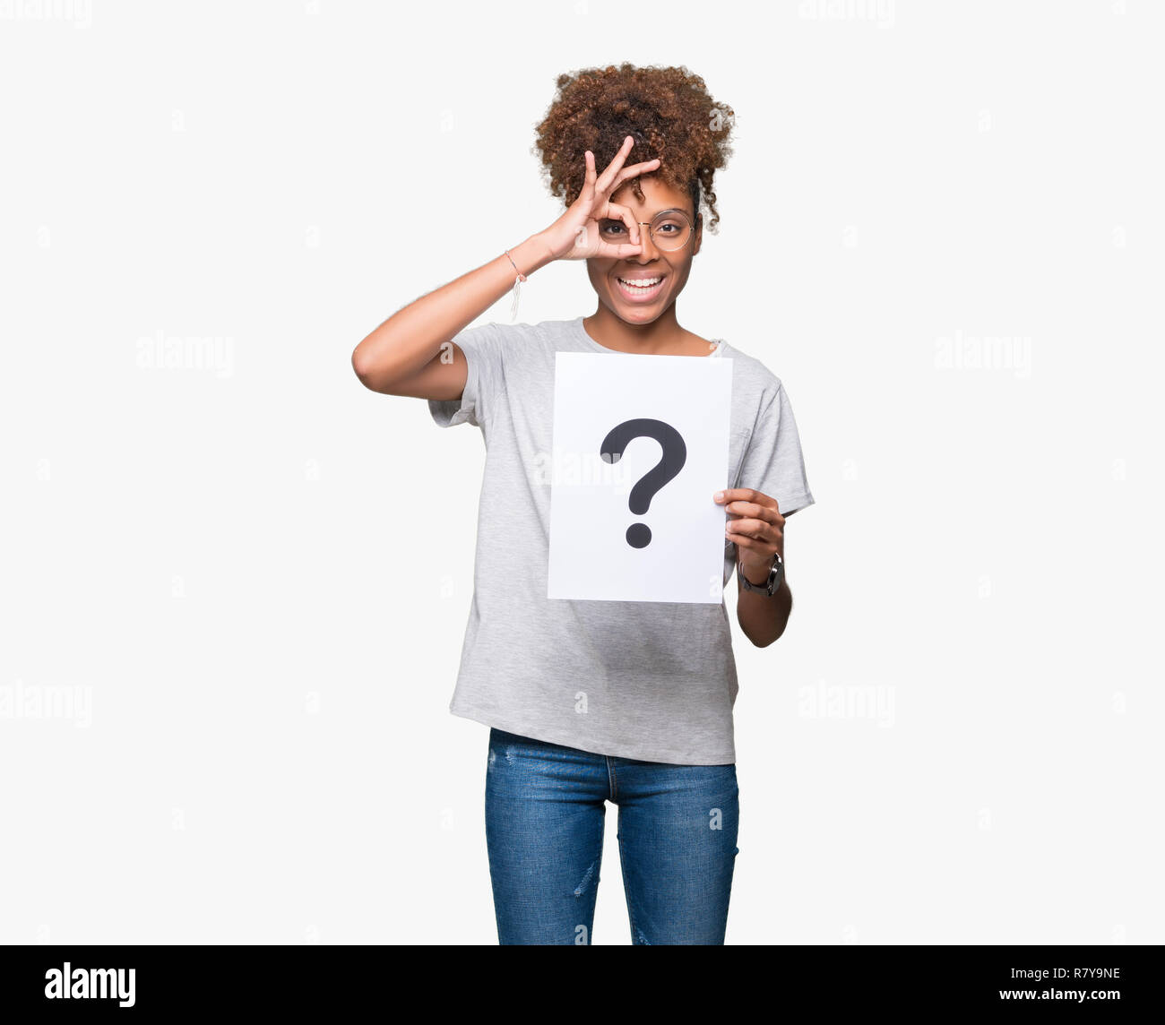 Young african american woman holding paper with question mark over ...