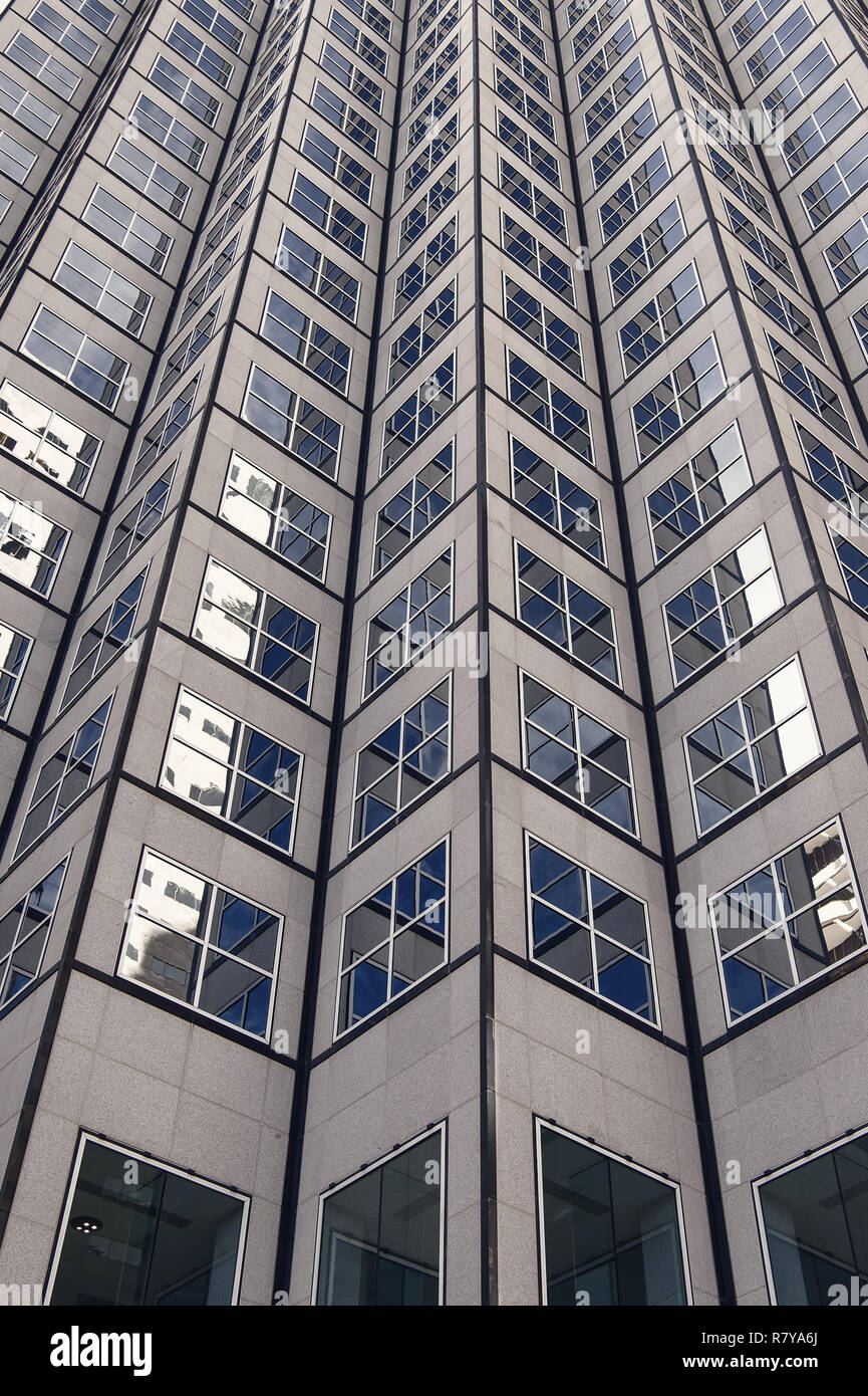 perspective wide angle view to steel blue background of glass high rise ...