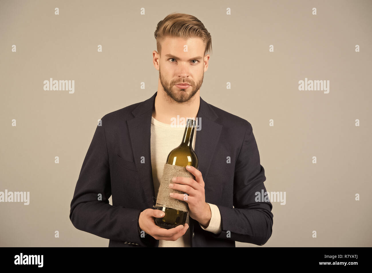 Boss with bottle of wine in hands. Bearded man hold alcoholic drink ...