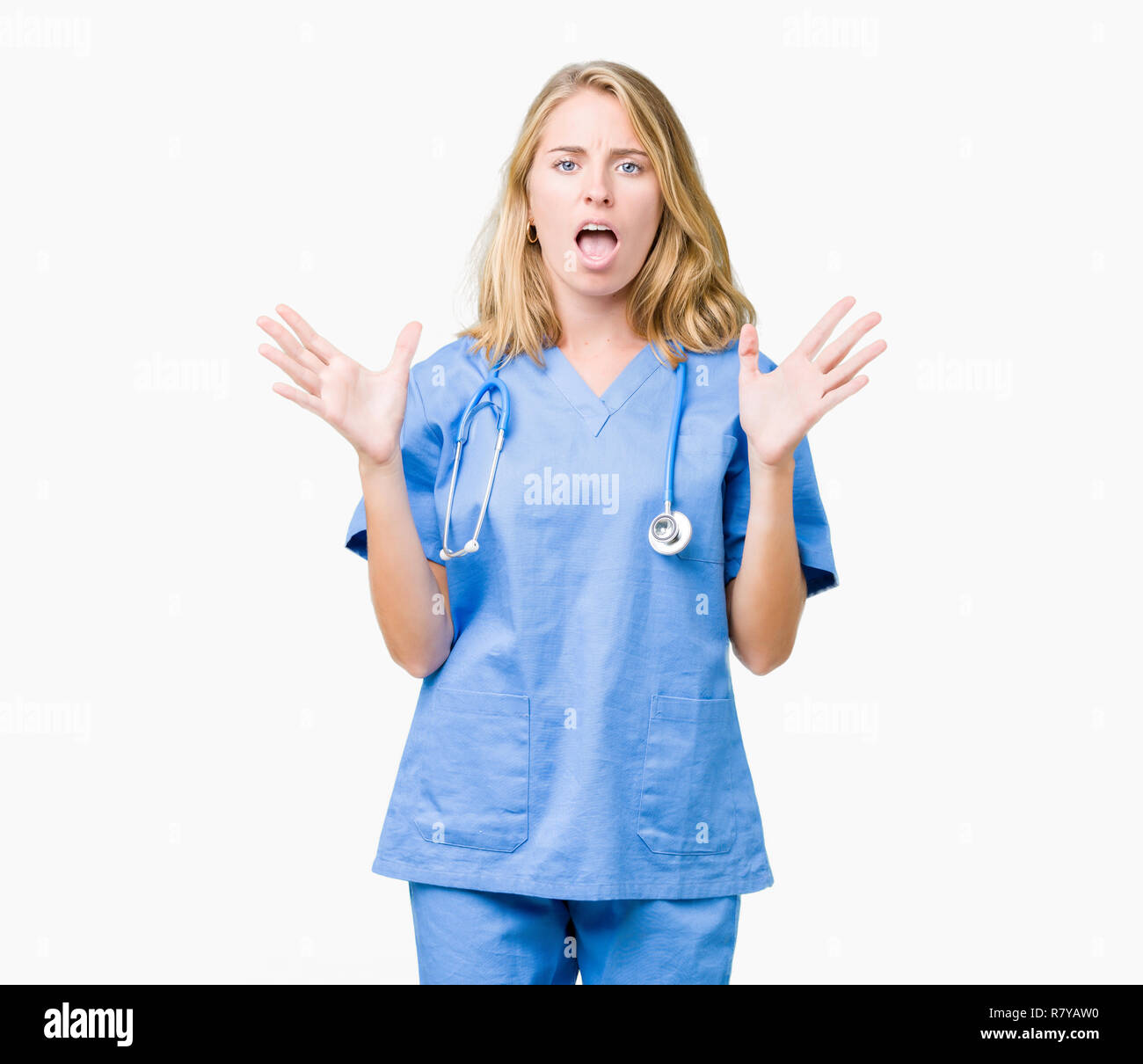 Beautiful young doctor woman wearing medical uniform over isolated ...