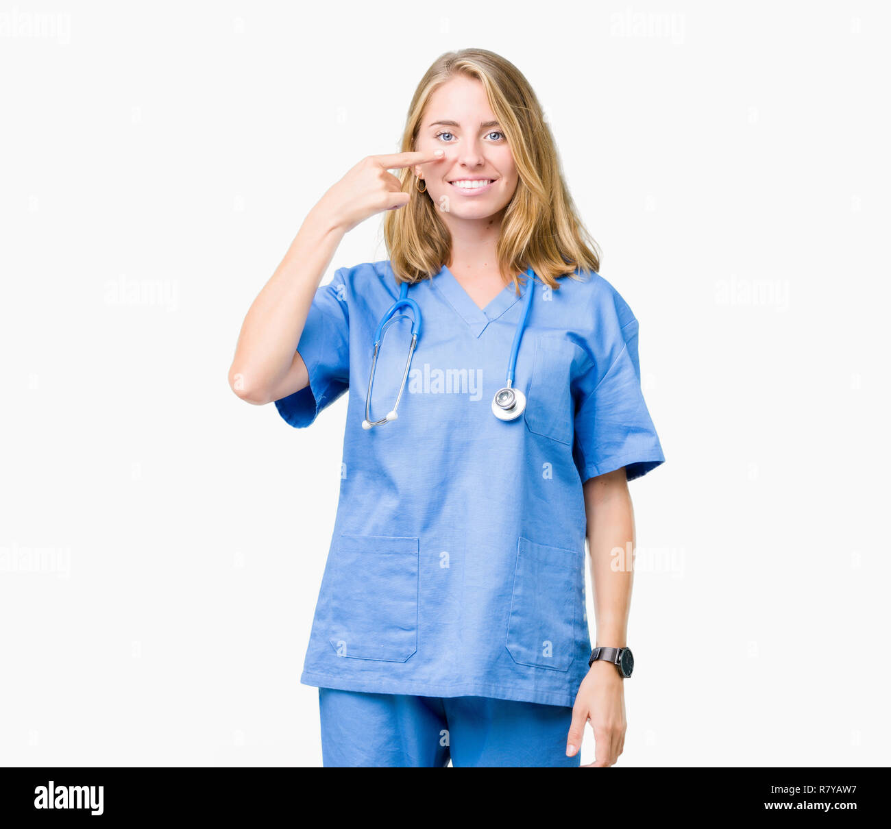 Beautiful young doctor woman wearing medical uniform over isolated ...