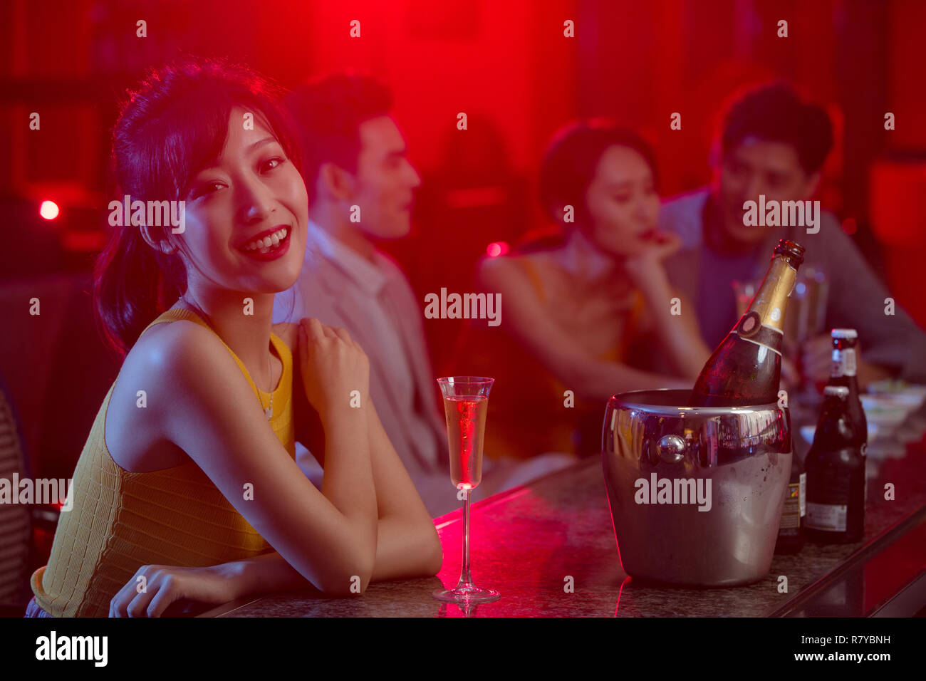 Young people drink in the bar Stock Photo - Alamy