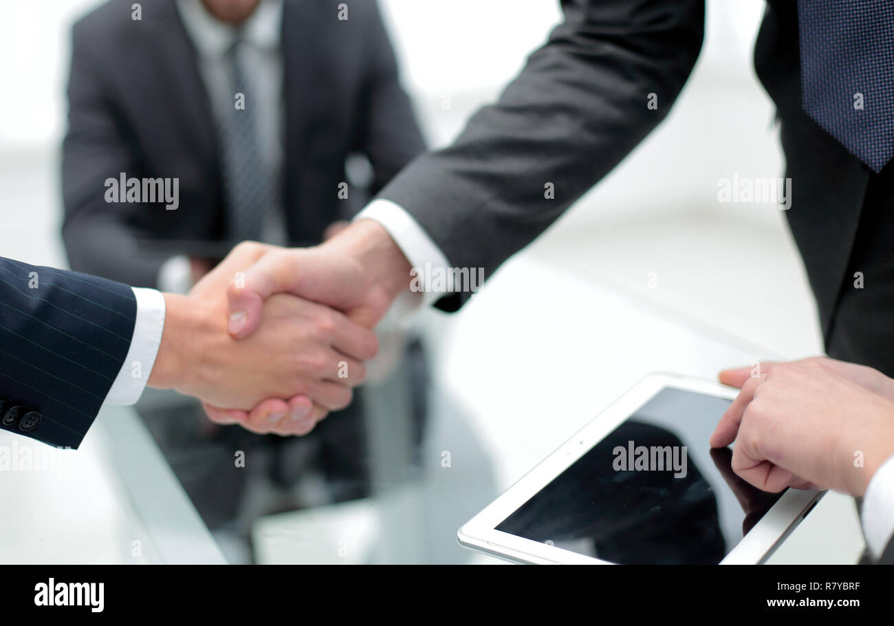close up.financial partners handshake Stock Photo - Alamy
