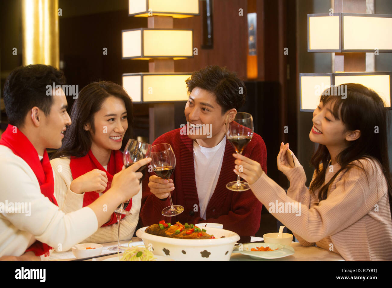 Young people in the restaurant for dinner Stock Photo - Alamy