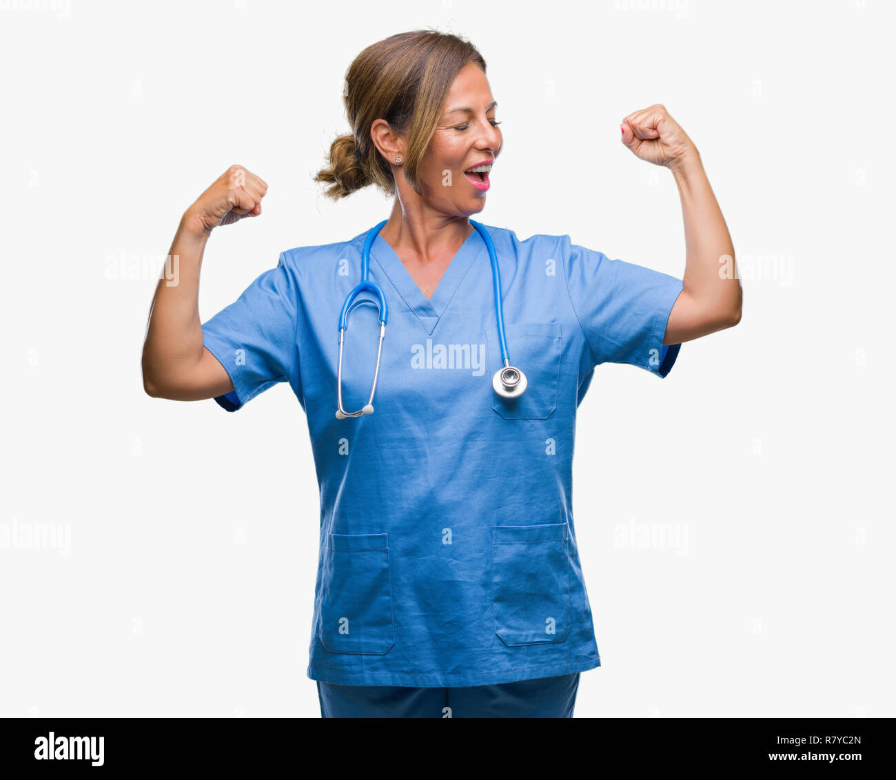 Middle age senior nurse doctor woman over isolated background showing ...