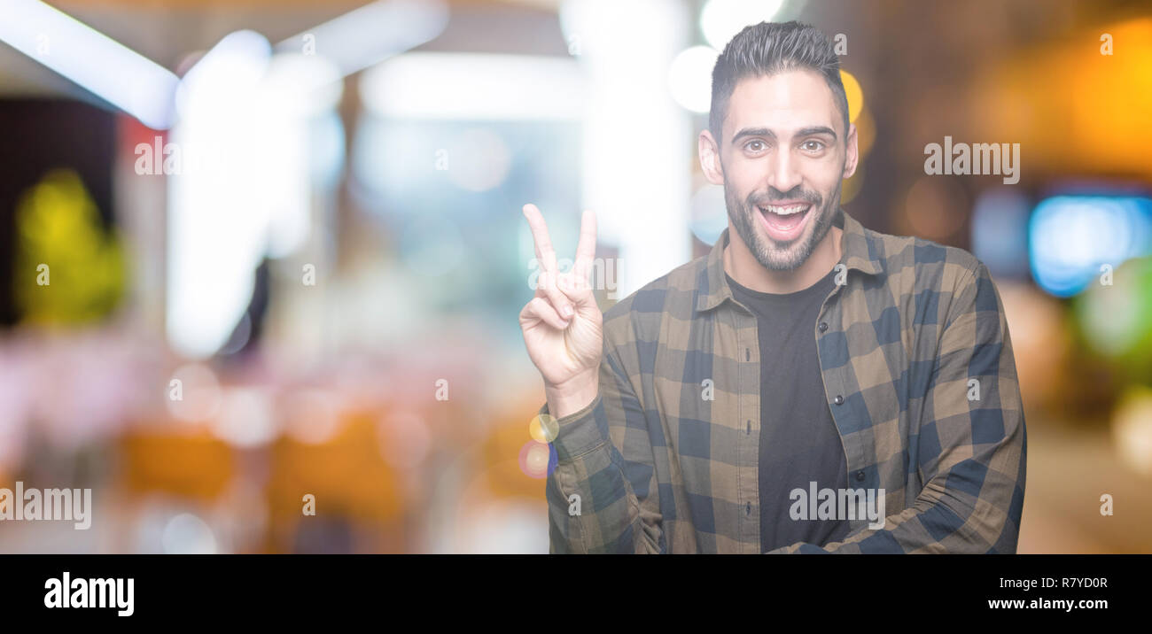 Young handsome man over isolated background smiling with happy face ...