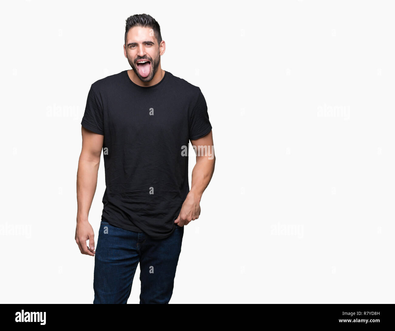 Young handsome man over isolated background sticking tongue out happy ...