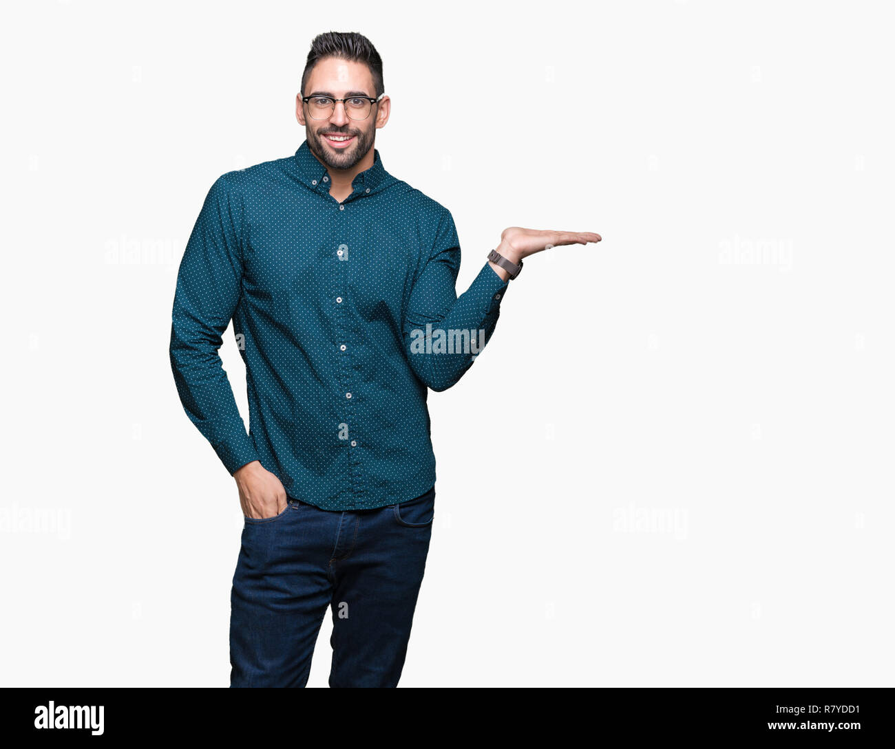 Young handsome business man wearing glasses over isolated background ...