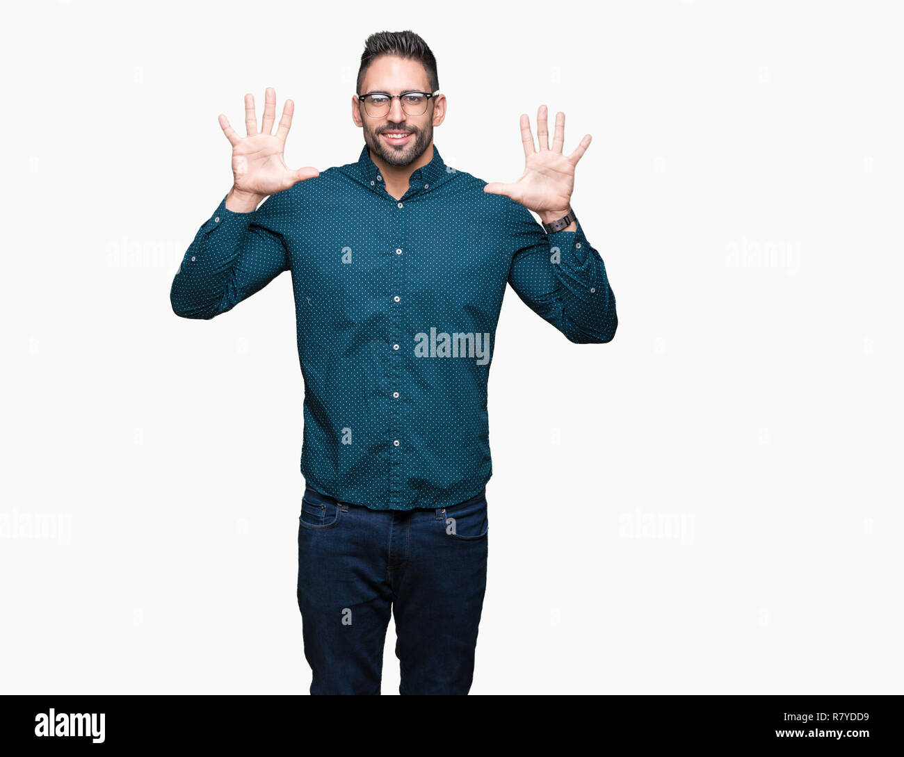 Young handsome business man wearing glasses over isolated background ...