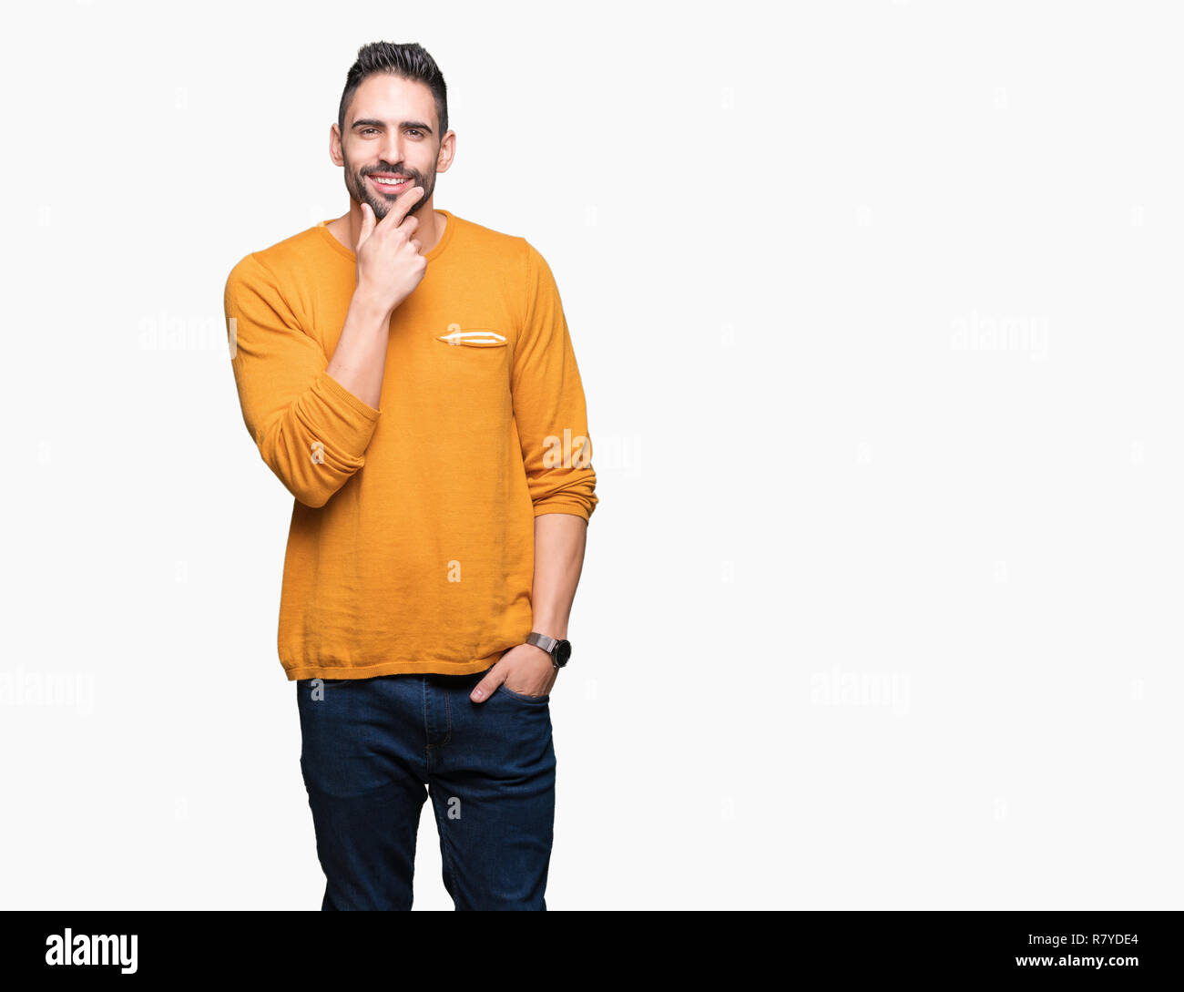 Young handsome man over isolated background looking confident at the ...
