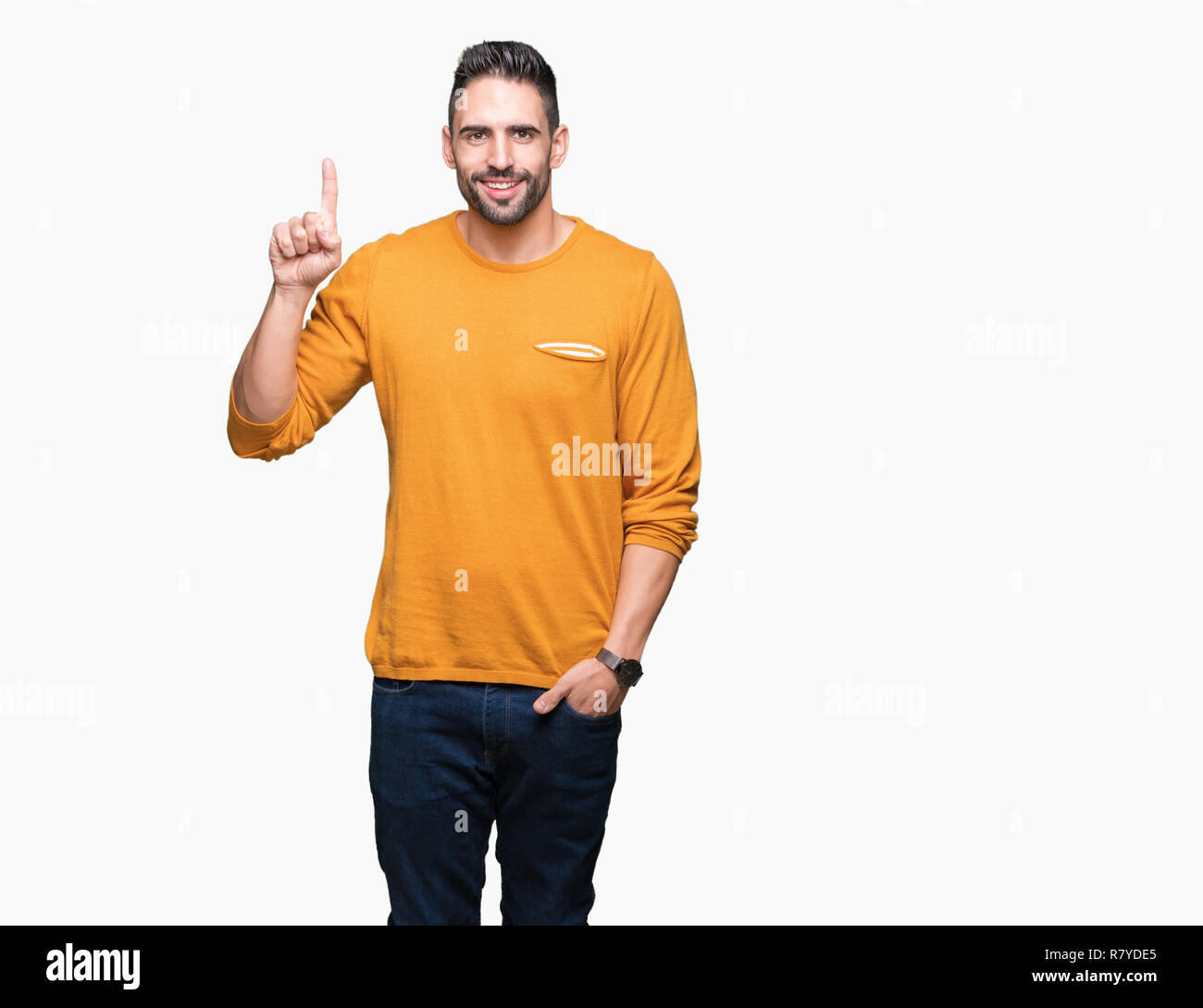 Young handsome man over isolated background showing and pointing up ...
