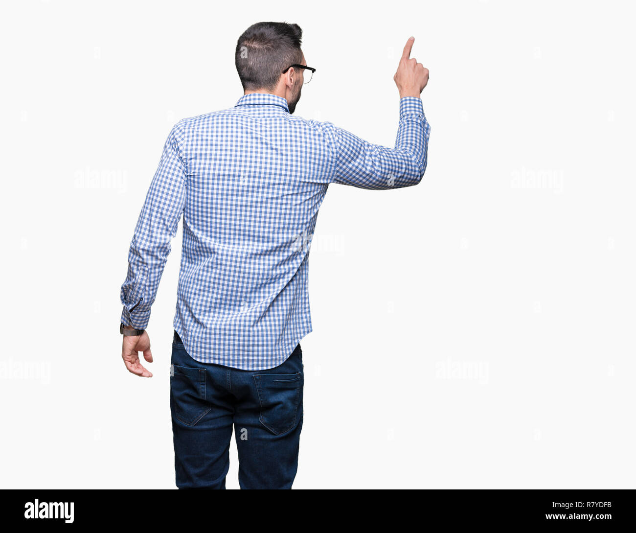 Young business man wearing glasses over isolated background Posing ...