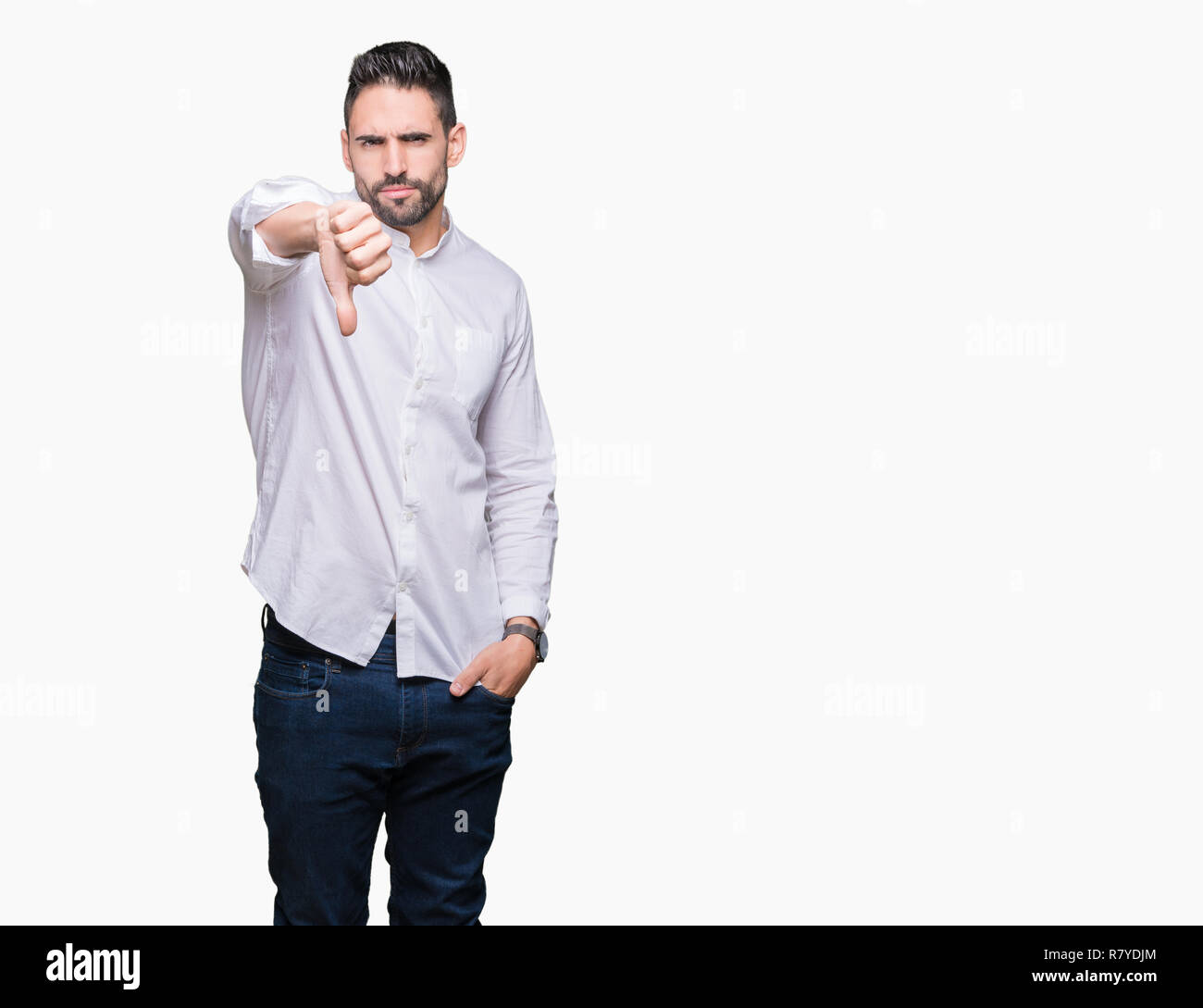 Young business man over isolated background looking unhappy and angry ...