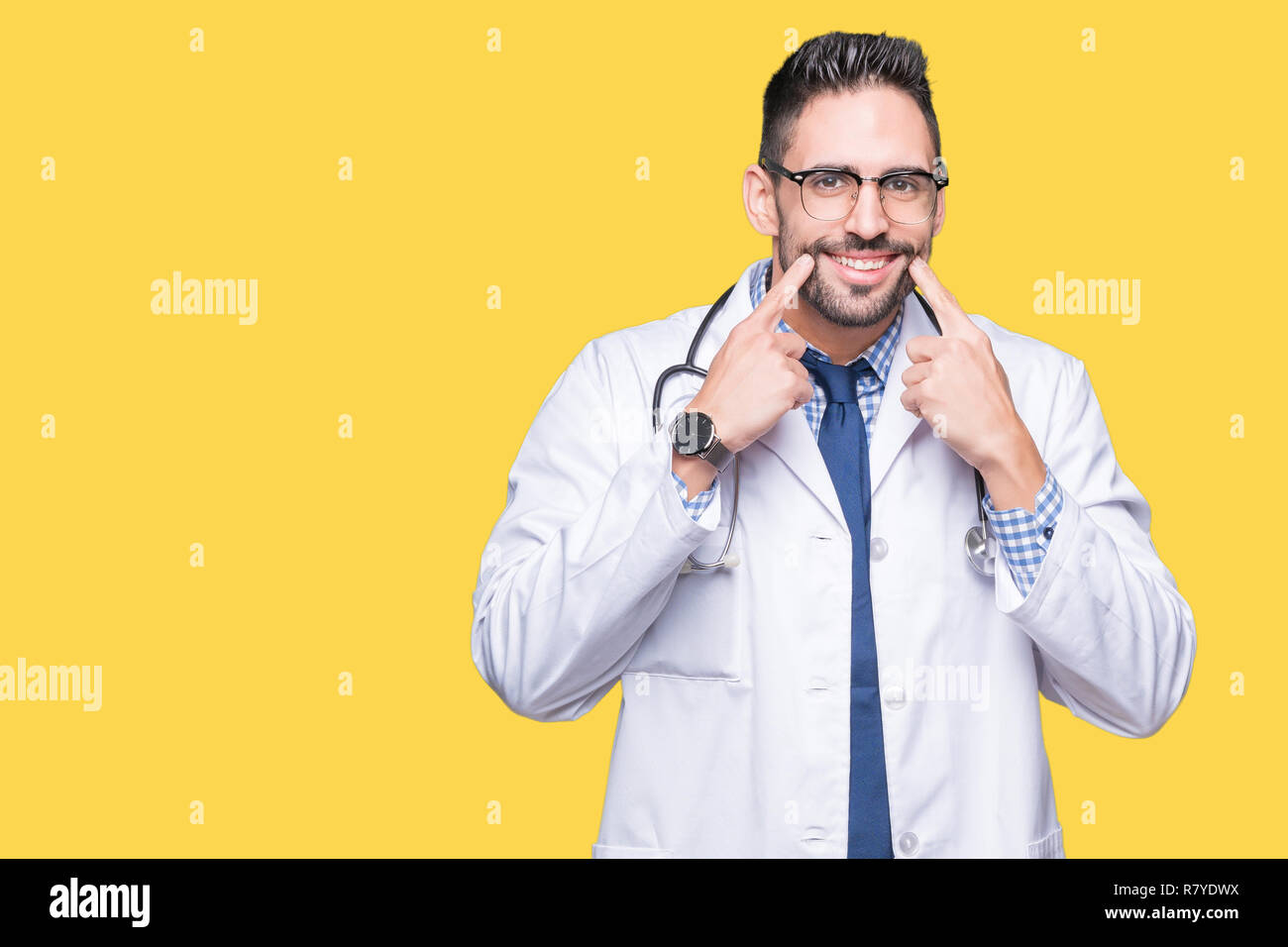 Handsome young doctor man over isolated background Smiling with open ...