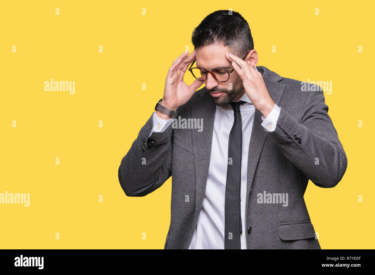 Young handsome business man over isolated background with hand on head ...