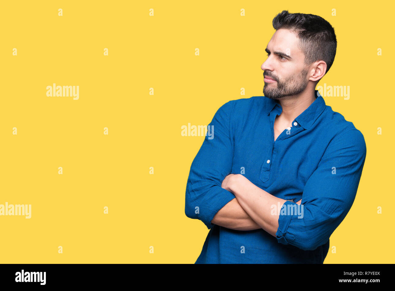 Young handsome man over isolated background smiling looking to the side ...