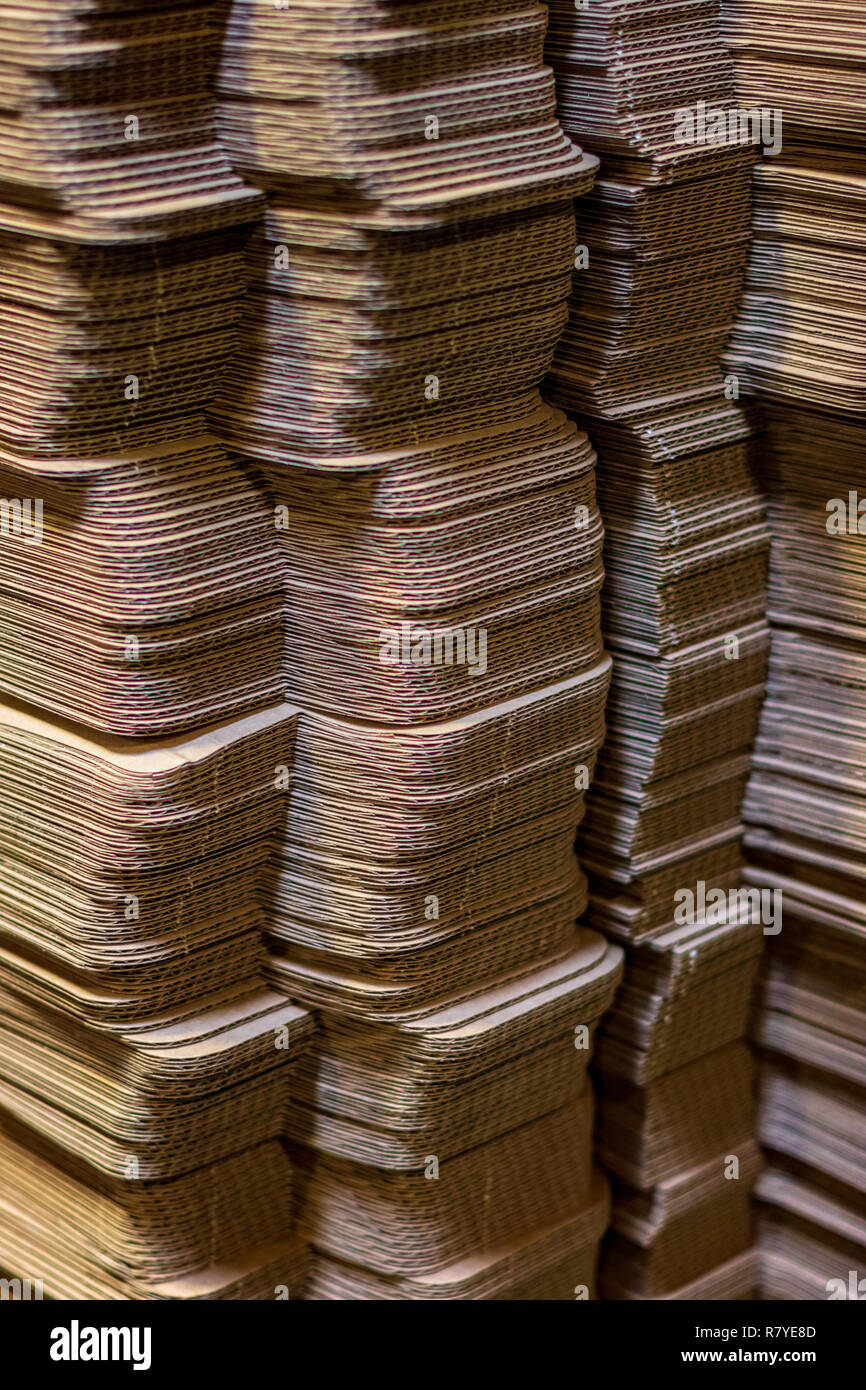 Corrugated cardboard boxes flattened stacked in rows Stock Photo - Alamy