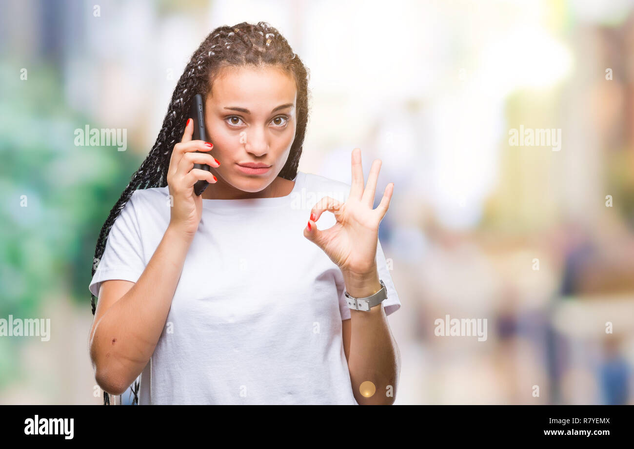 Young braided hair african american girl showing calling using ...