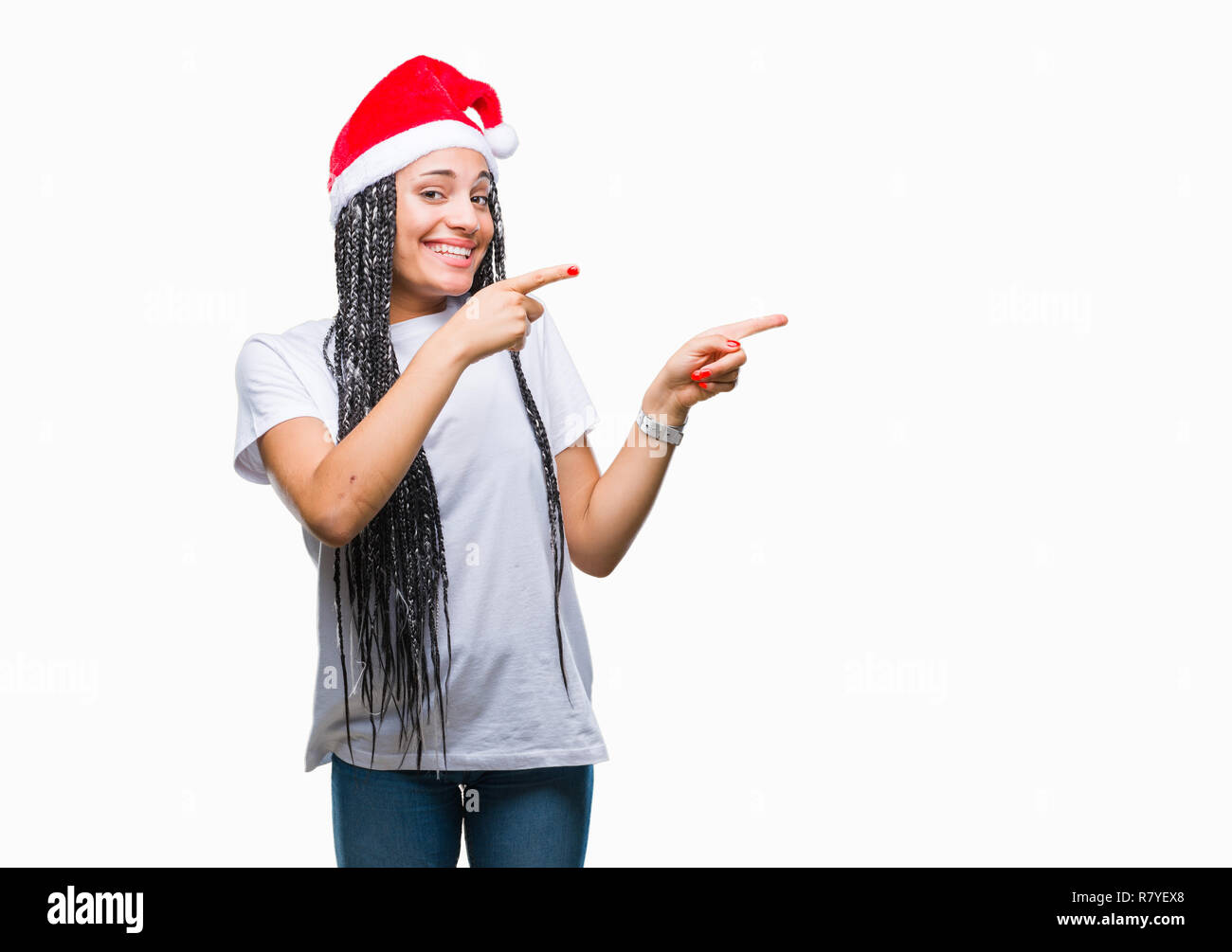 Young braided hair african american girl wearing christmas hat over ...