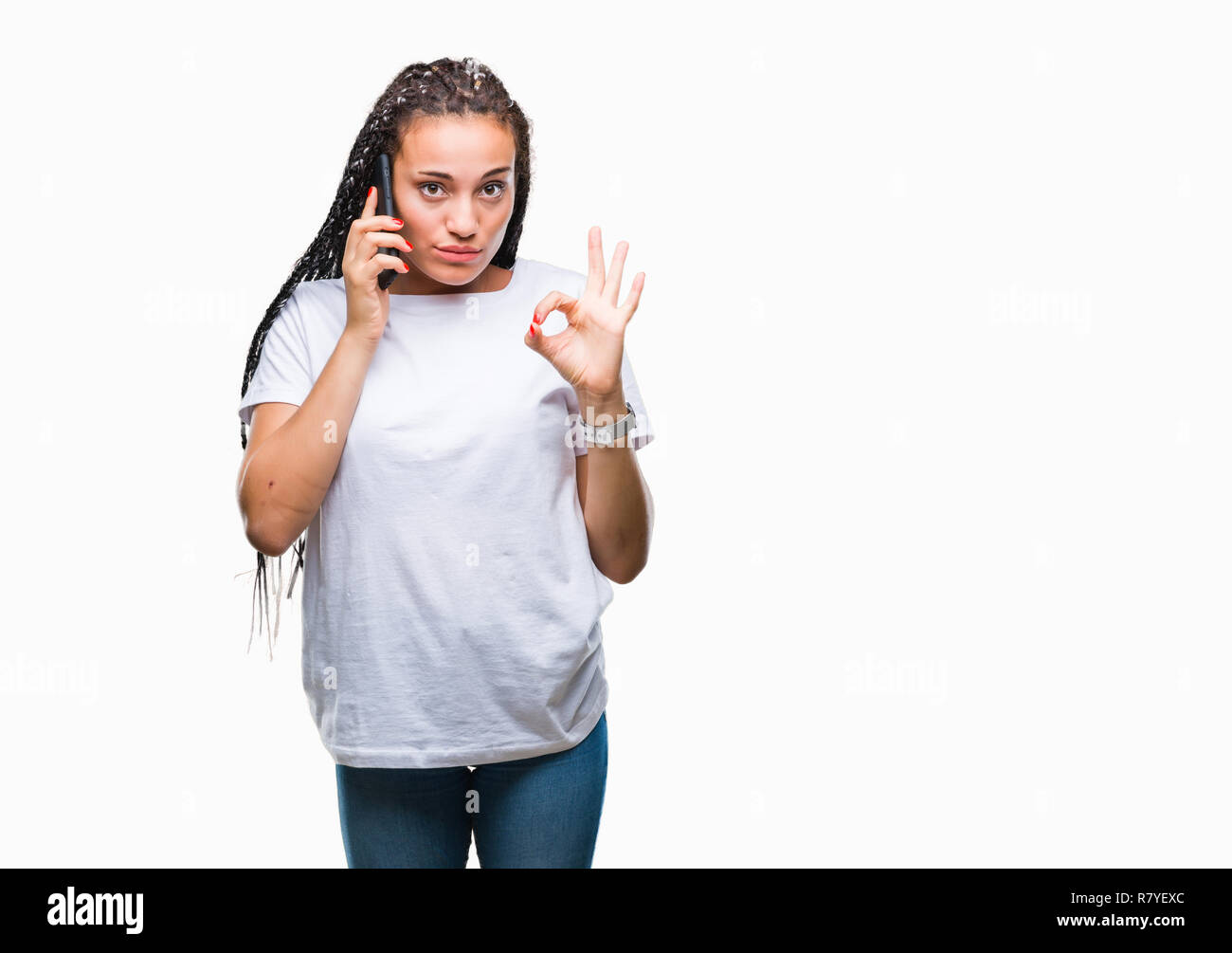 Young braided hair african american girl showing calling using ...
