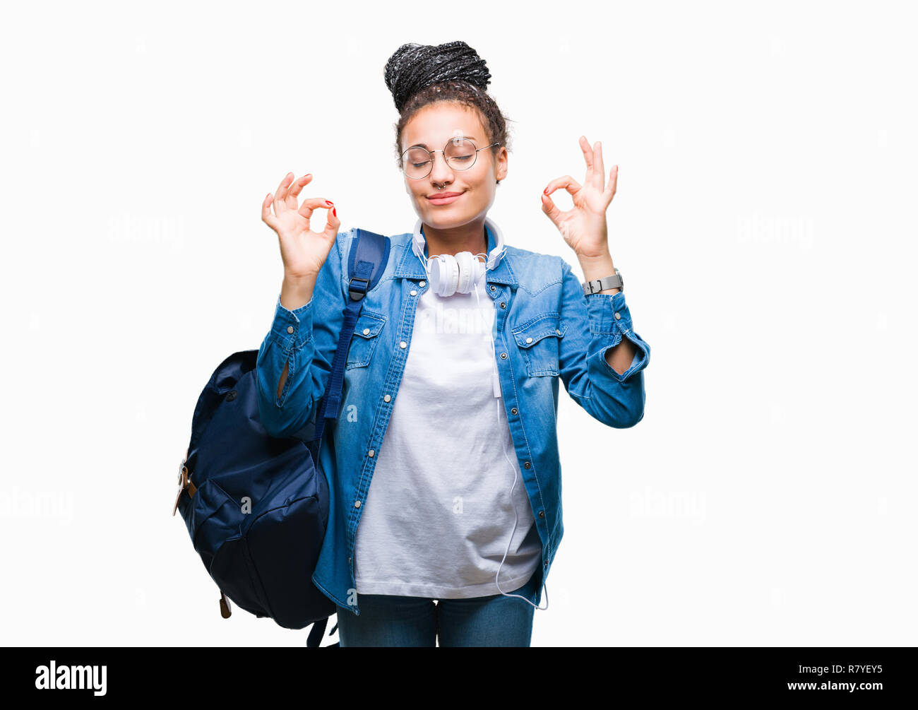 Young braided hair african american student girl wearing backpack over ...