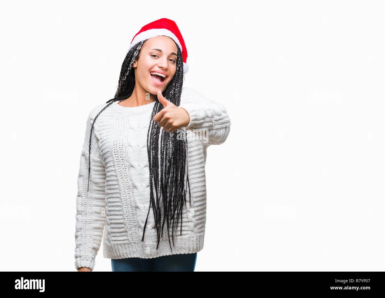 Young braided hair african american girl wearing christmas hat over ...