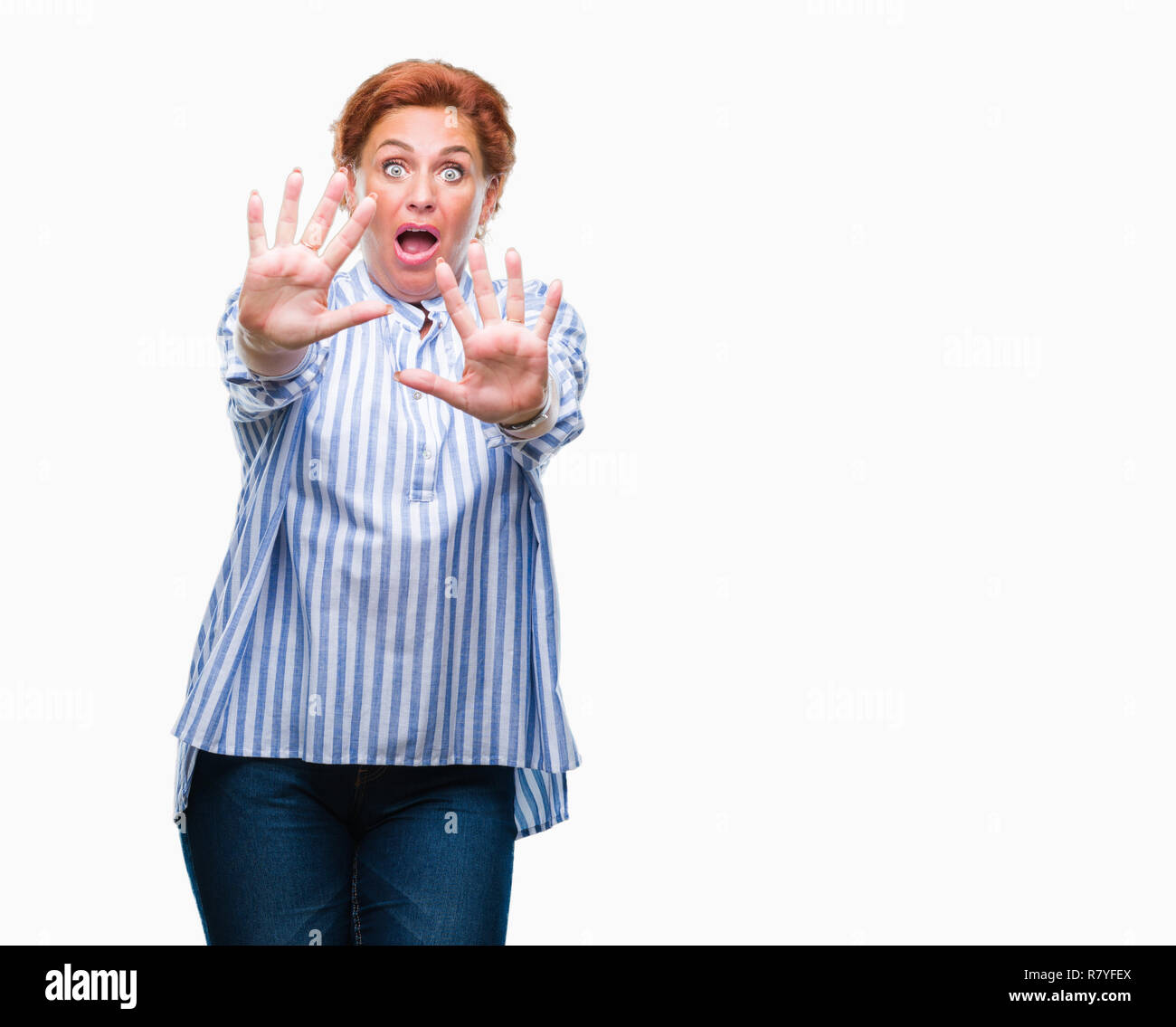 Atrractive senior caucasian redhead woman over isolated background ...