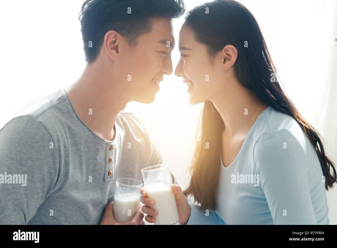 Young couples to drink milk Stock Photo - Alamy