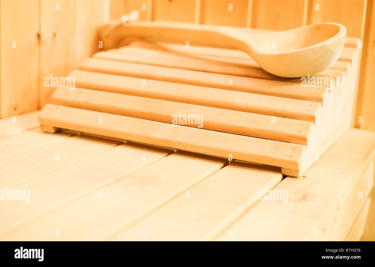 Interior of traditional classic wooden finnish sauna with headrest and ...