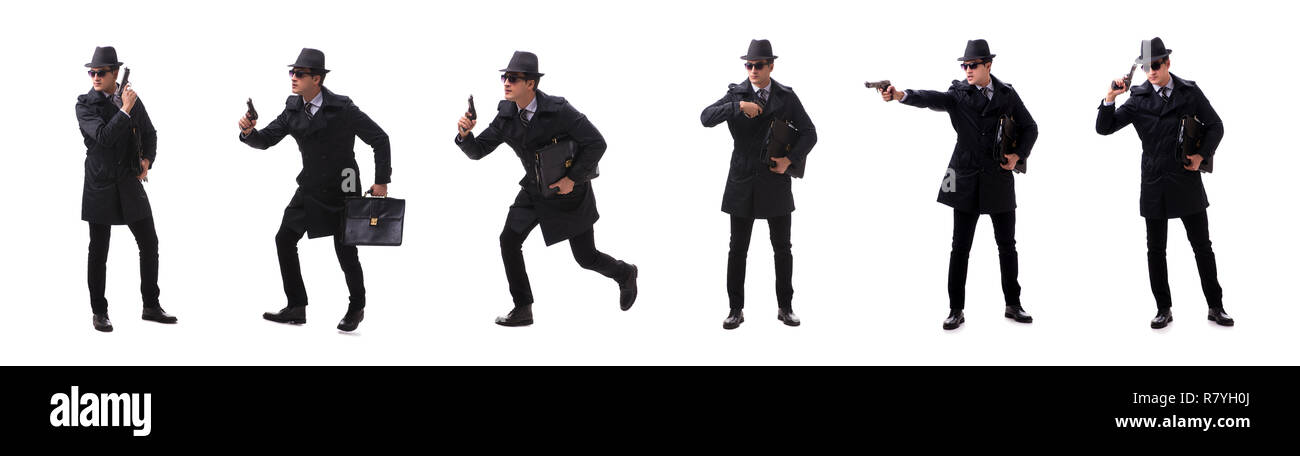 Man spy with handgun isolated on white background Stock Photo - Alamy