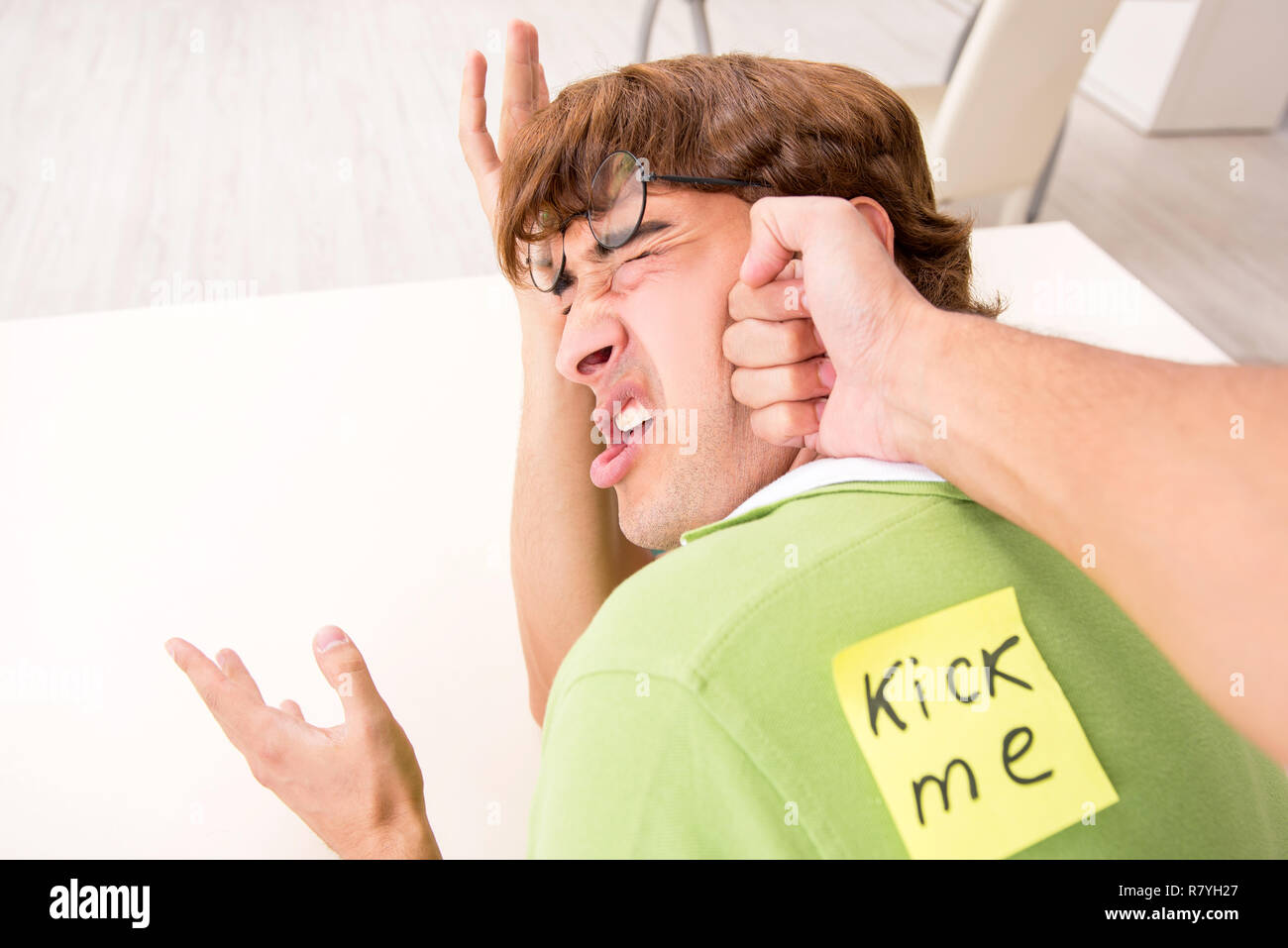 Office prank with kick me message on sticky note Stock Photo - Alamy