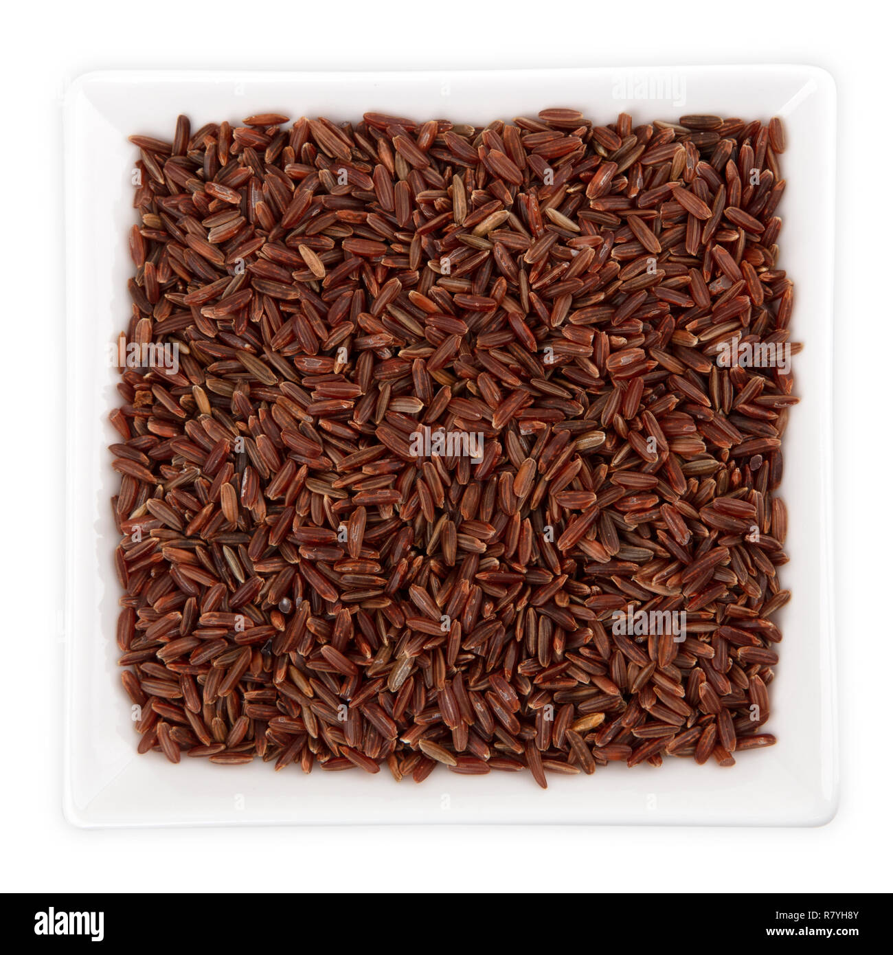 Red Rice in a bowl isolated on white background Stock Photo - Alamy