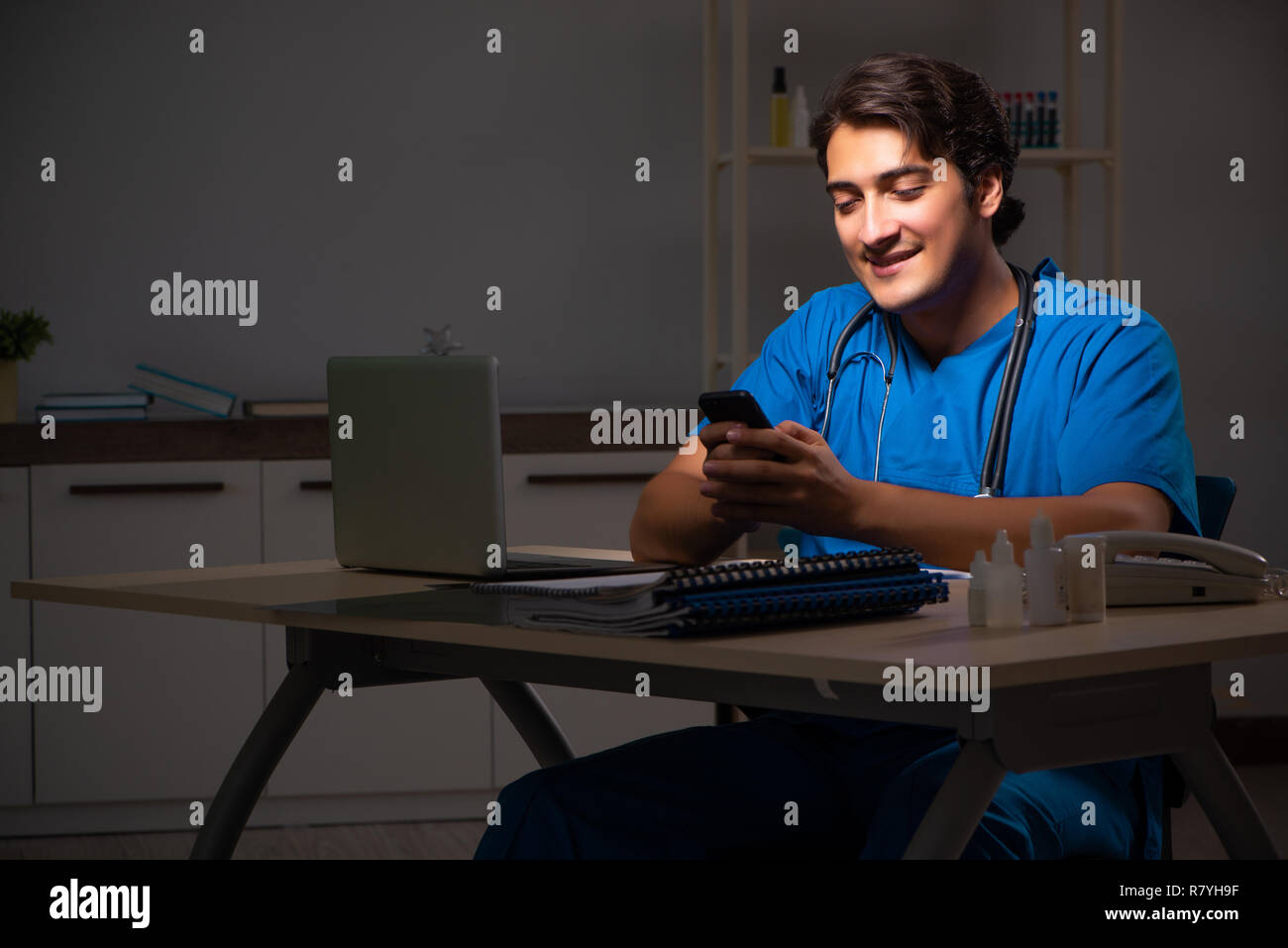 Young handsome doctor working night shift in hospital Stock Photo - Alamy