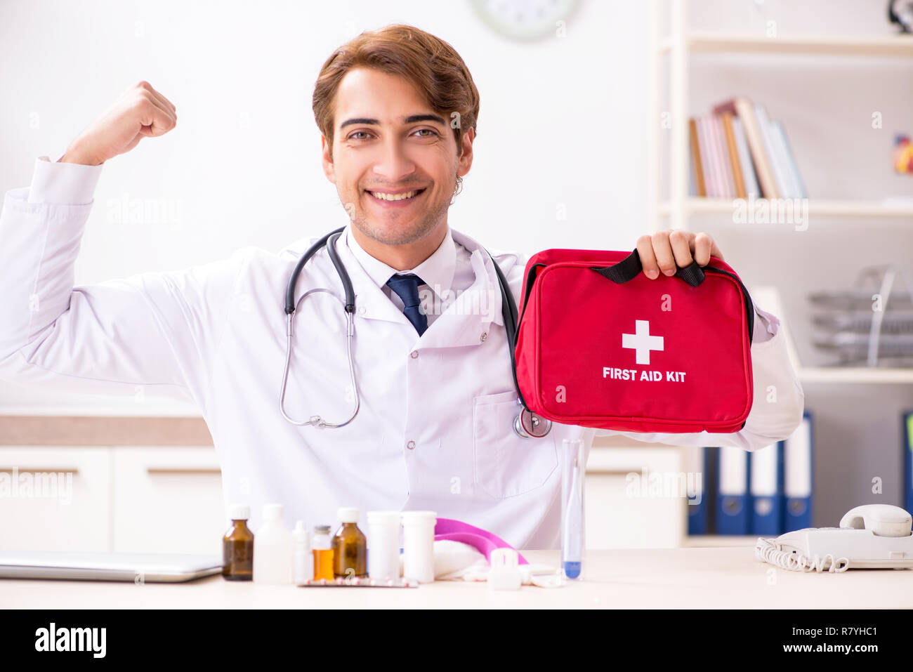 Young doctor with first aid kit in hospital Stock Photo - Alamy