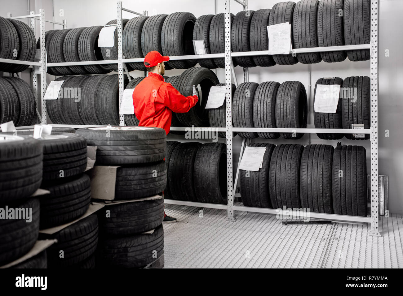 Car salesman and tyres hi-res stock photography and images - Alamy