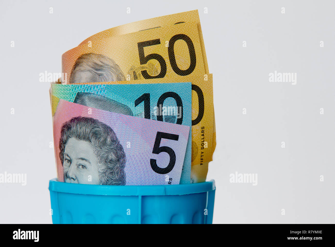 Australian dollar notes in a blue garbage bin Stock Photo - Alamy